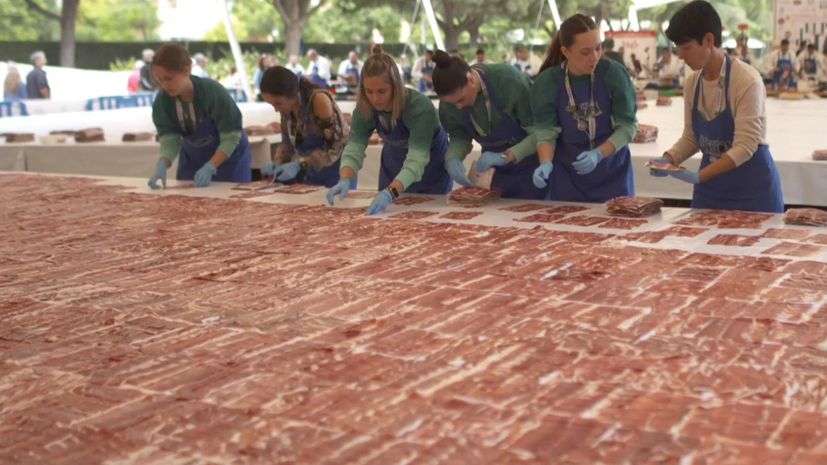 Meaty madness! Jamon carvers slice their way to Guinness Record making ...