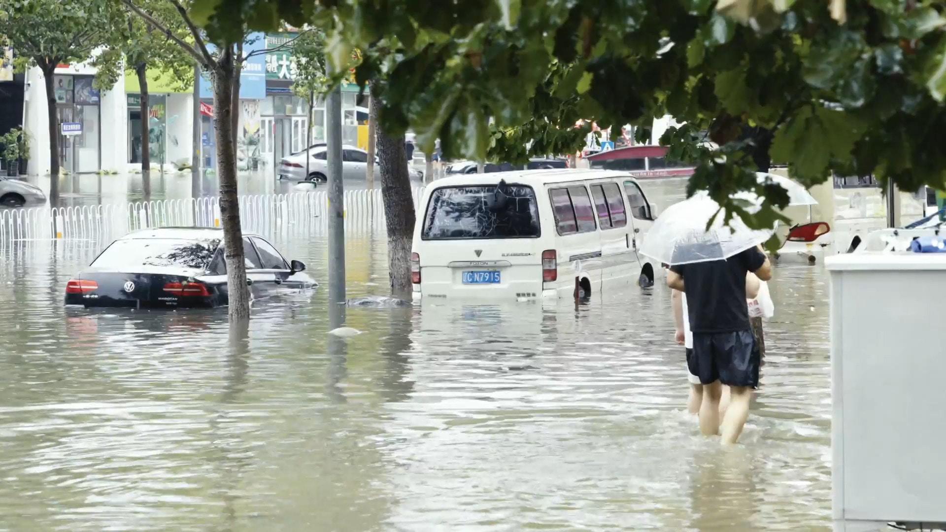 Cars submerged in water as roads flood amid heavy rainfall in China's ...