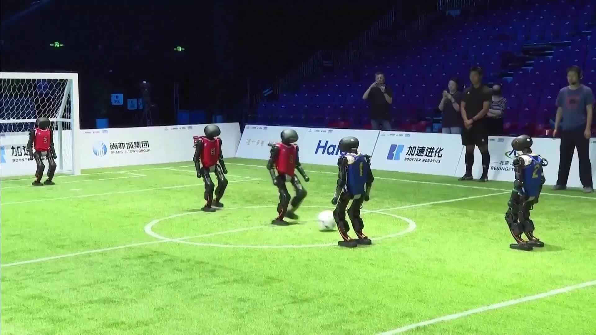 Robo-football! Fully autonomous humanoid bots compete in Beijing's 3-on ...