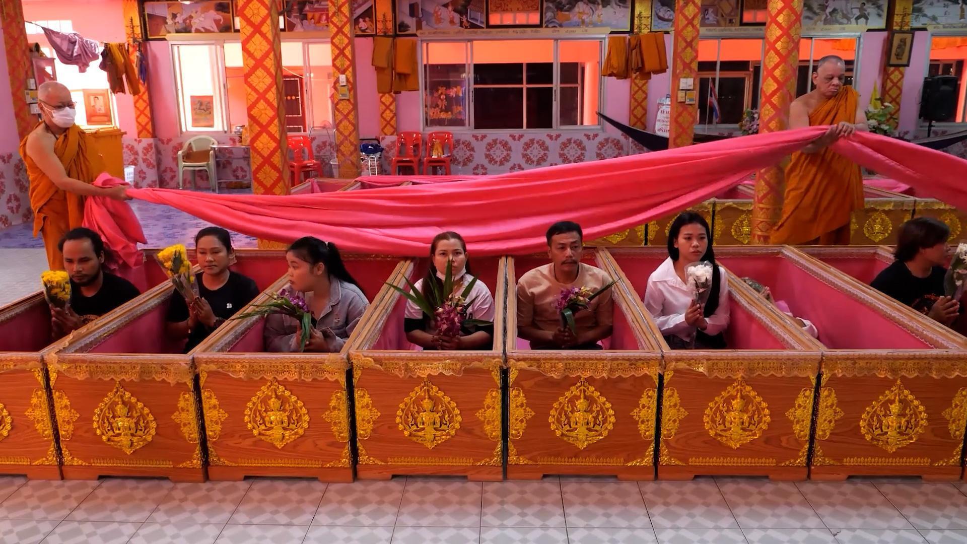 New Year's rebirth - Thai devotees 'resurrect' themselves in coffin ...