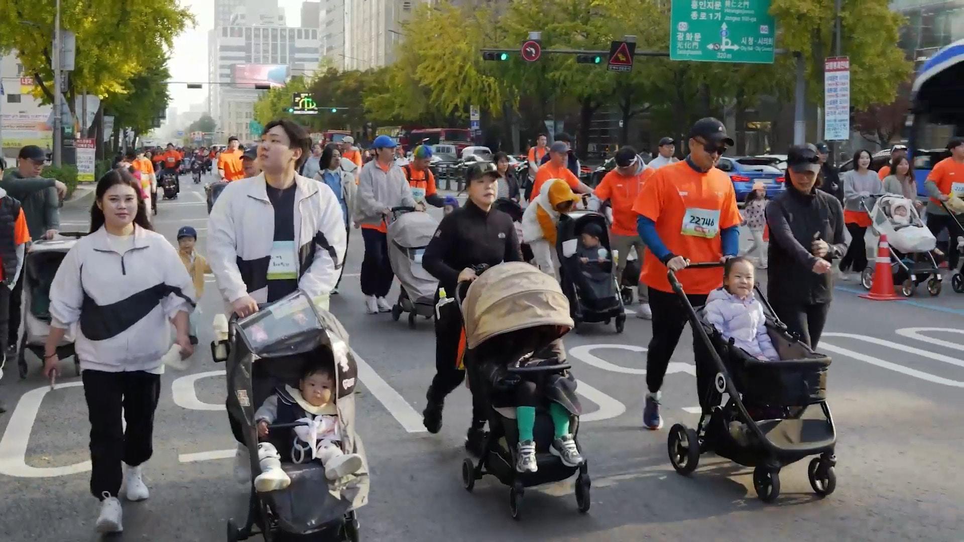Buckle up, babies! Thousands of strollers roll through Seoul as ...