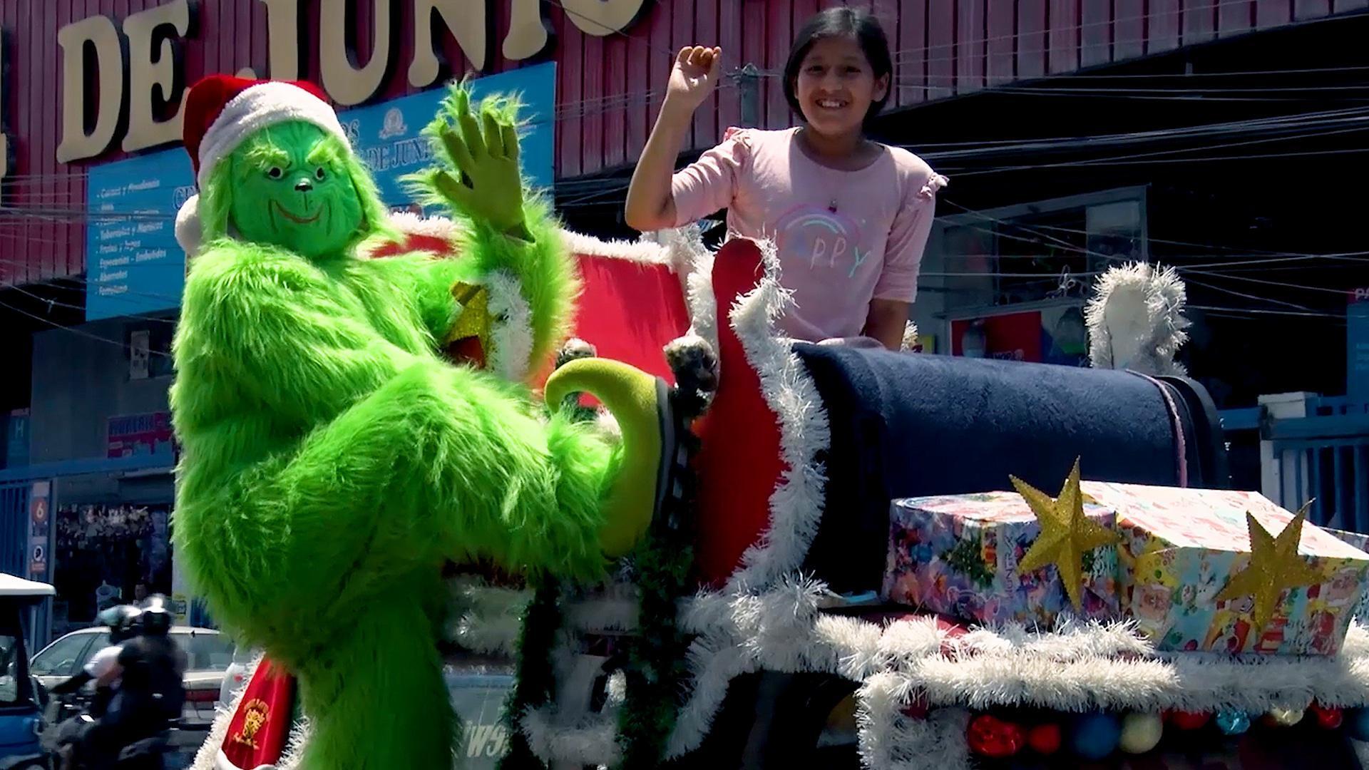 The Grinch who saved Christmas! Costumed mototaxi driver brings festive ...
