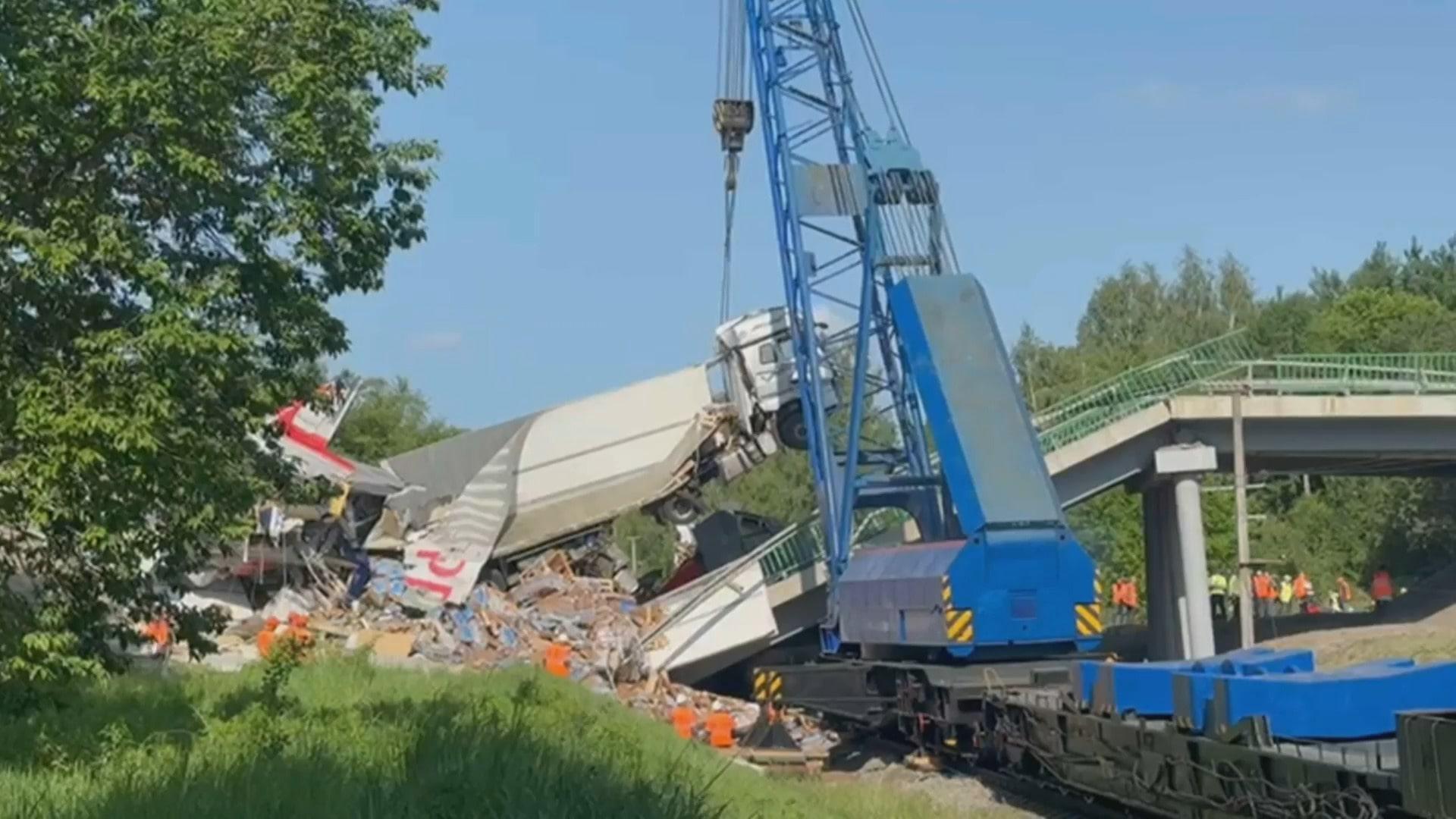 Truck lifted from toppled bridge after deadly rail disaster in Russia's ...
