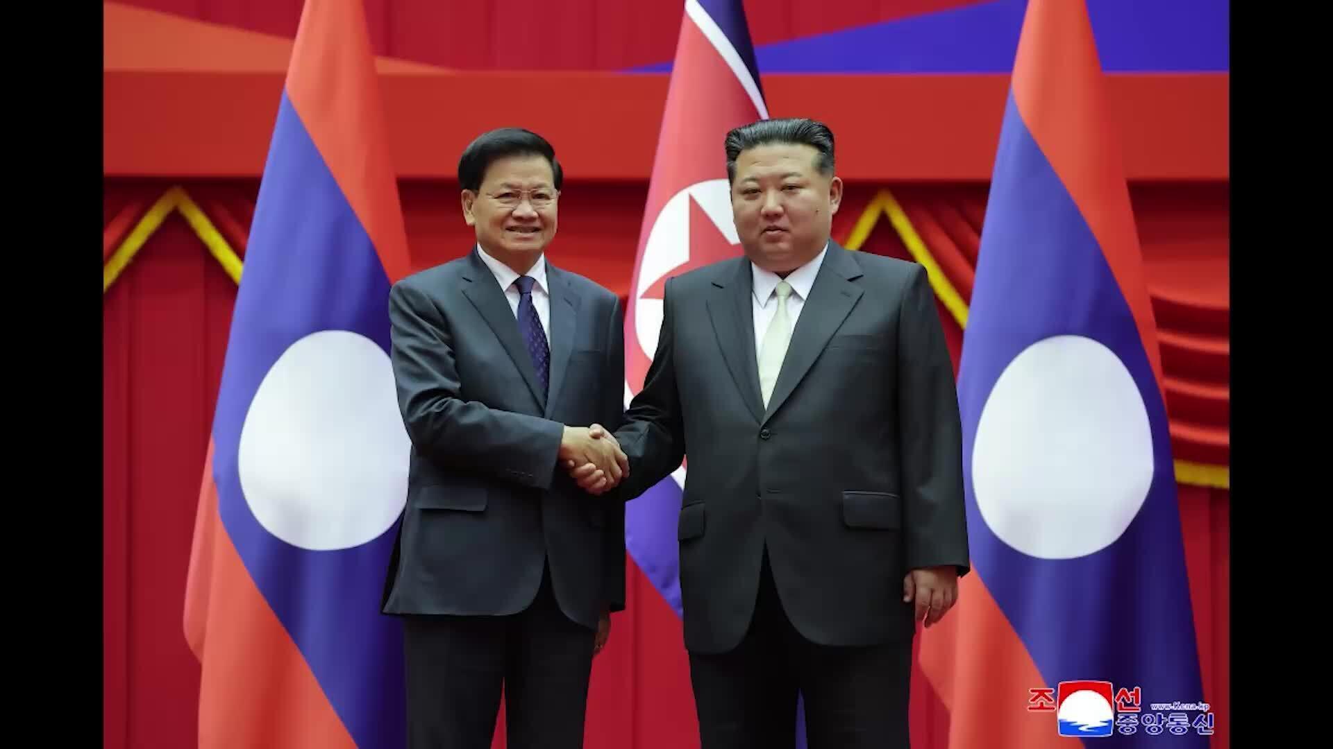 Salutes and smiles - DPRK leader welcomes Lao President with grand ...