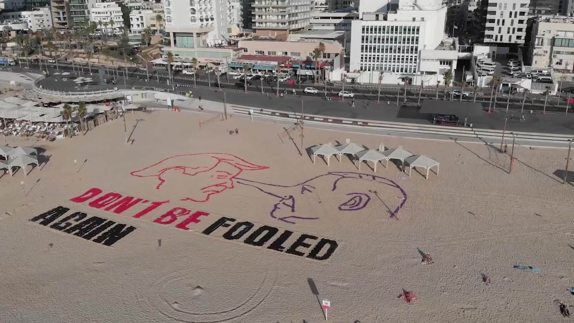 'Don't be fooled again!' - Drone captures giant protest message to ...