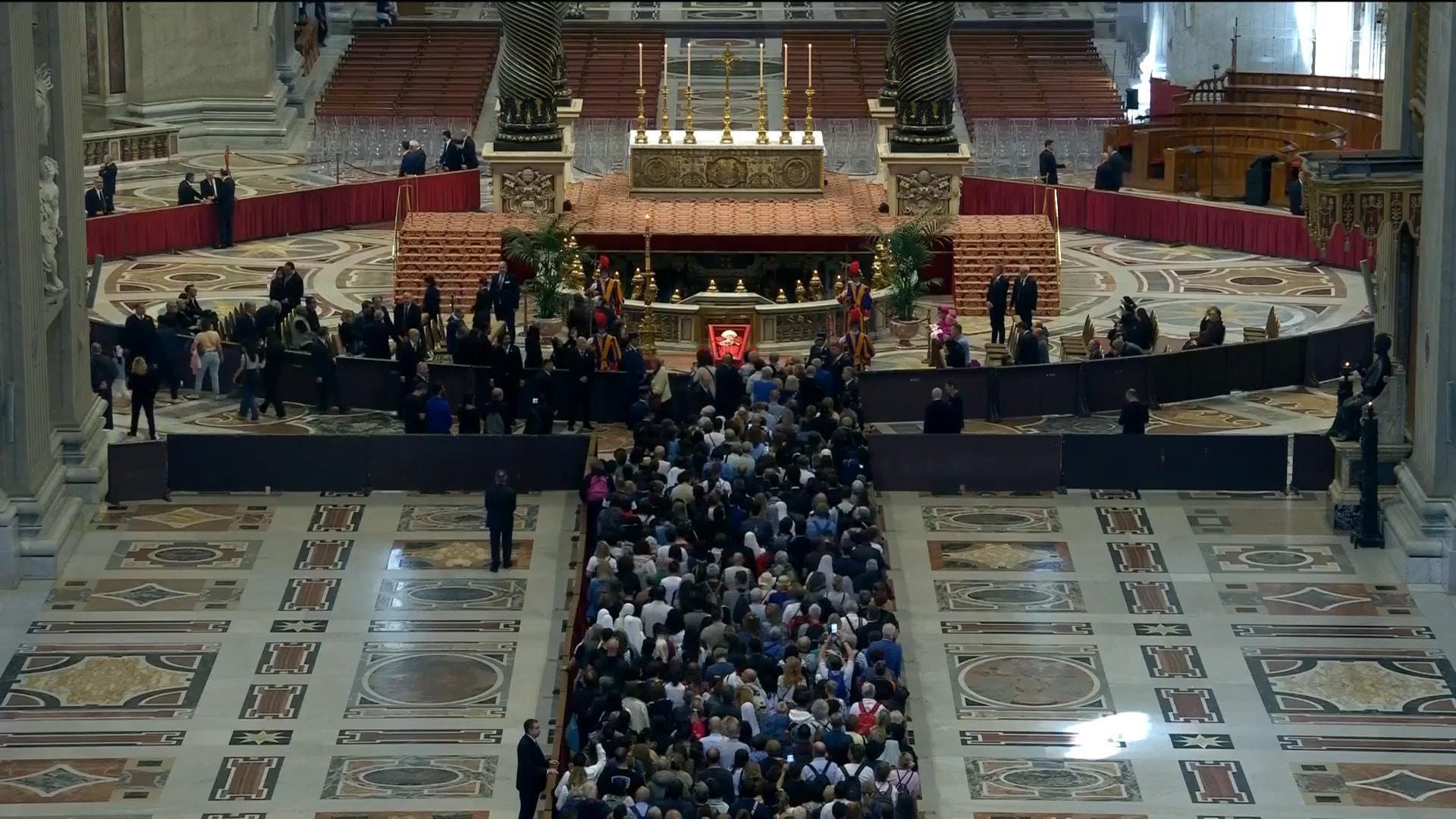 Public outpouring of grief - Thousands file past Pope's open casket in ...