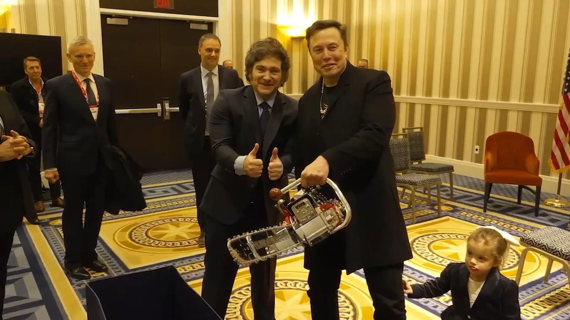 Oh, you shouldn't have! Milei presents Musk with gold chainsaw ...