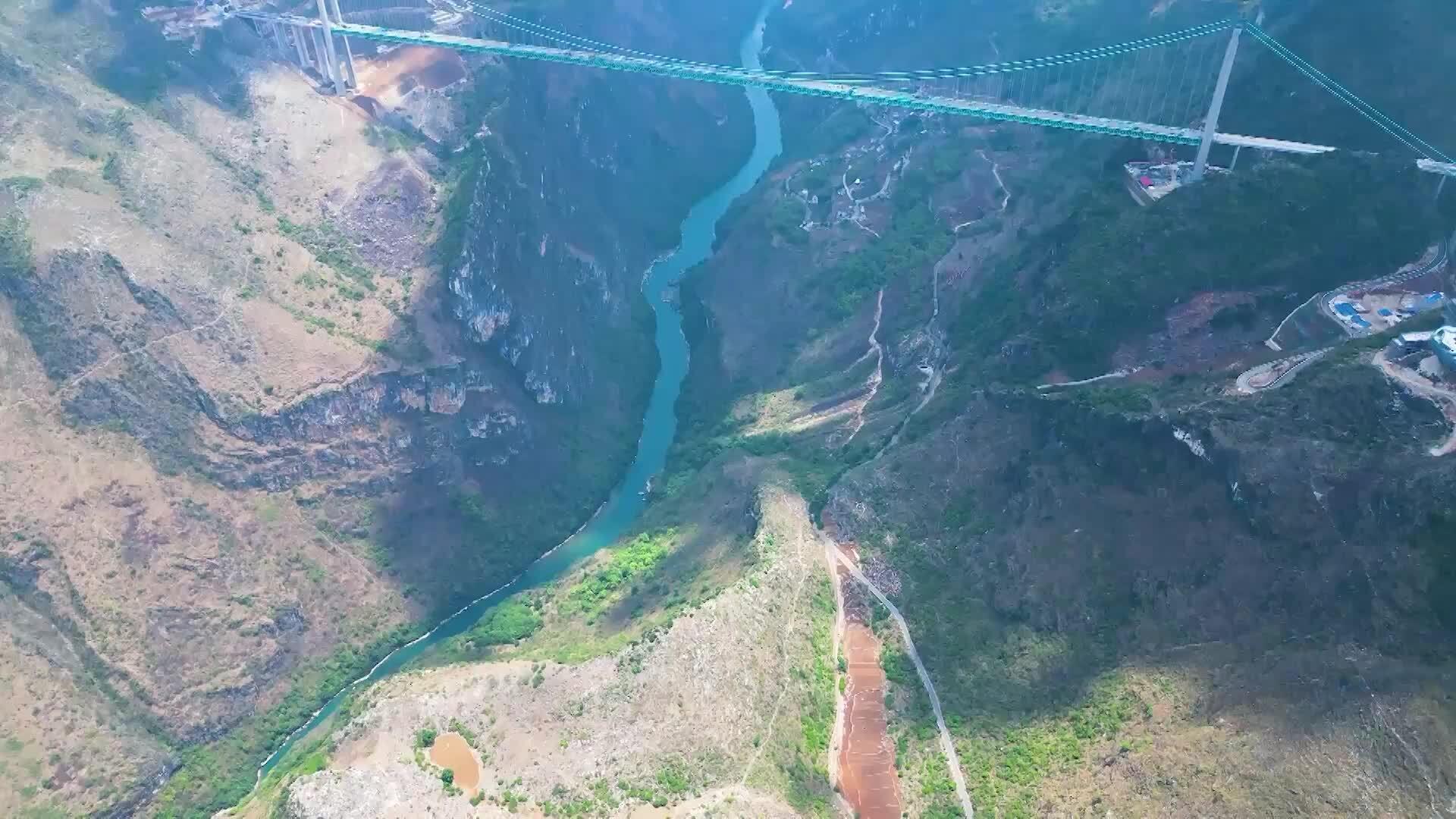 Above the clouds! World’s highest bridge gets final touches in China’s ...