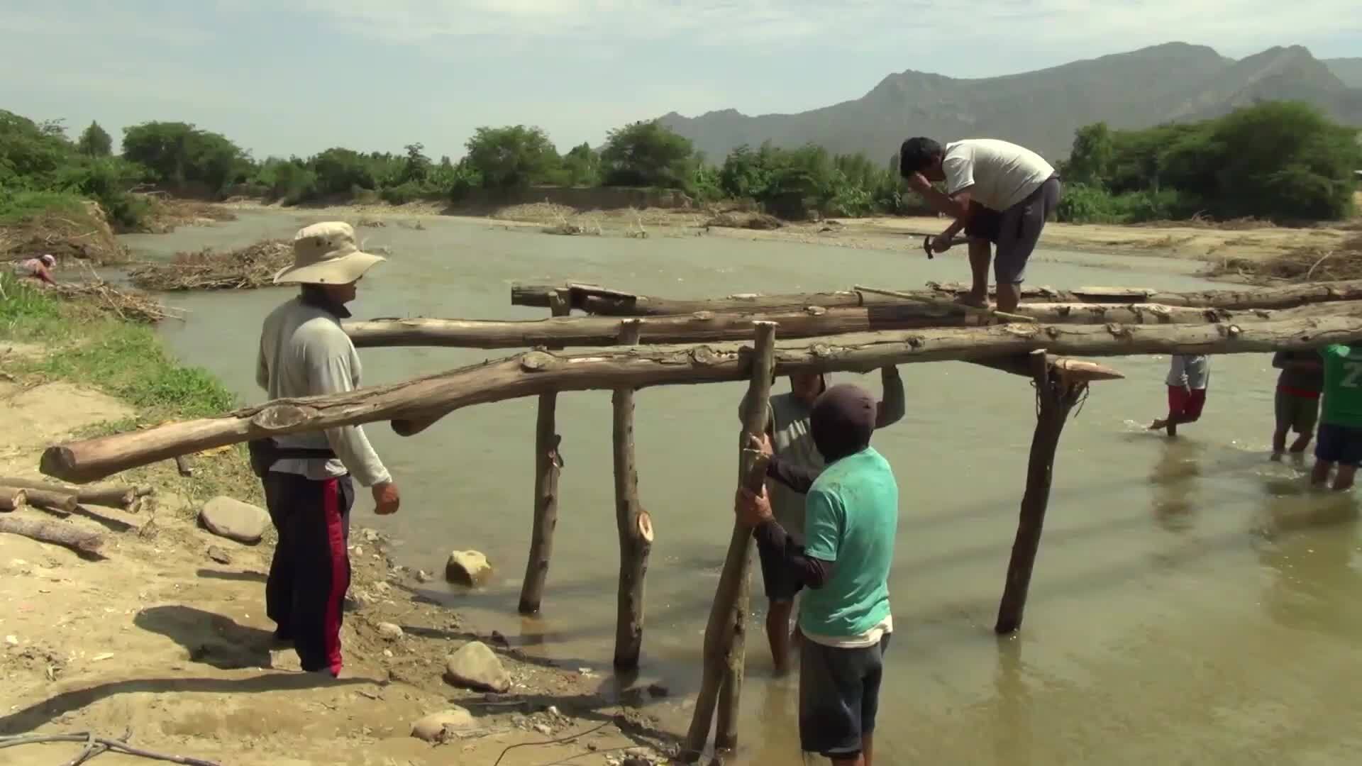 DIY or get rinsed - Locals build makeshift bridge to cross dangerous ...