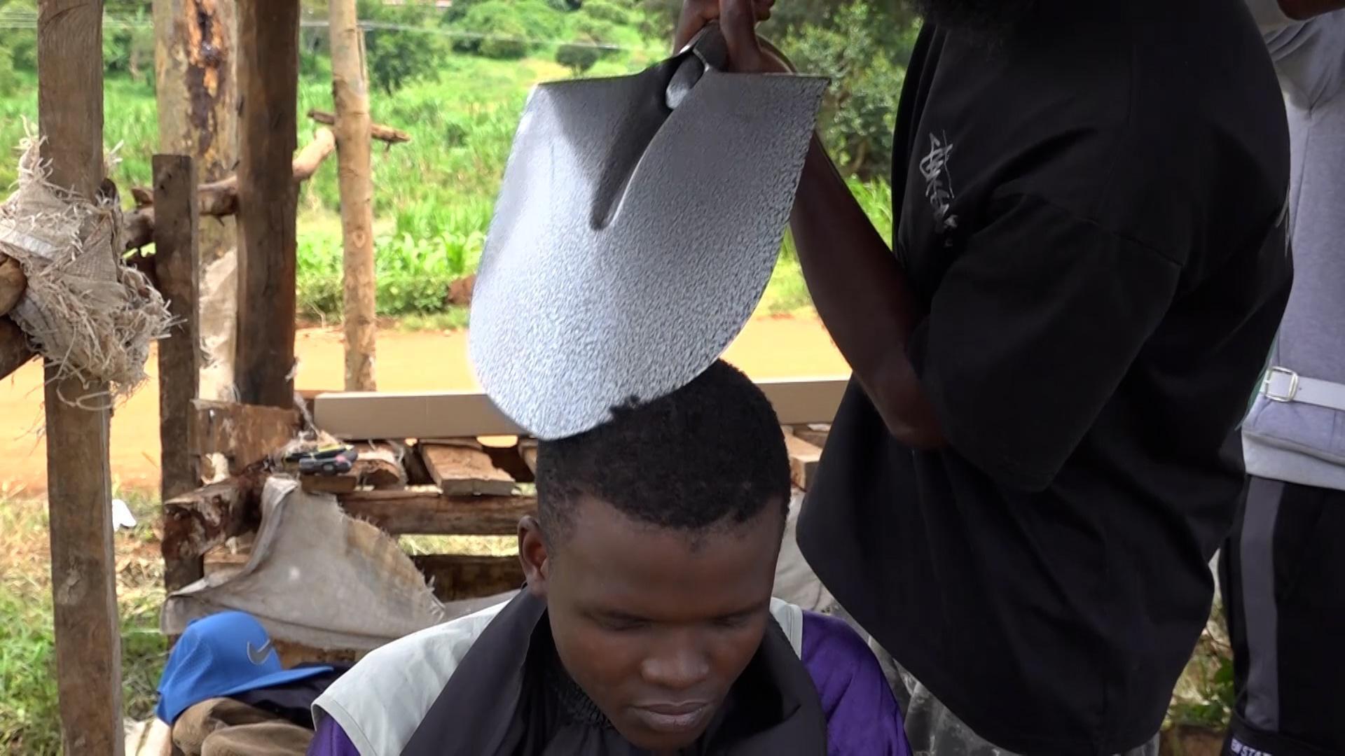 Cutting it close! Viral Kenya barber uses machetes, shovels and other ...