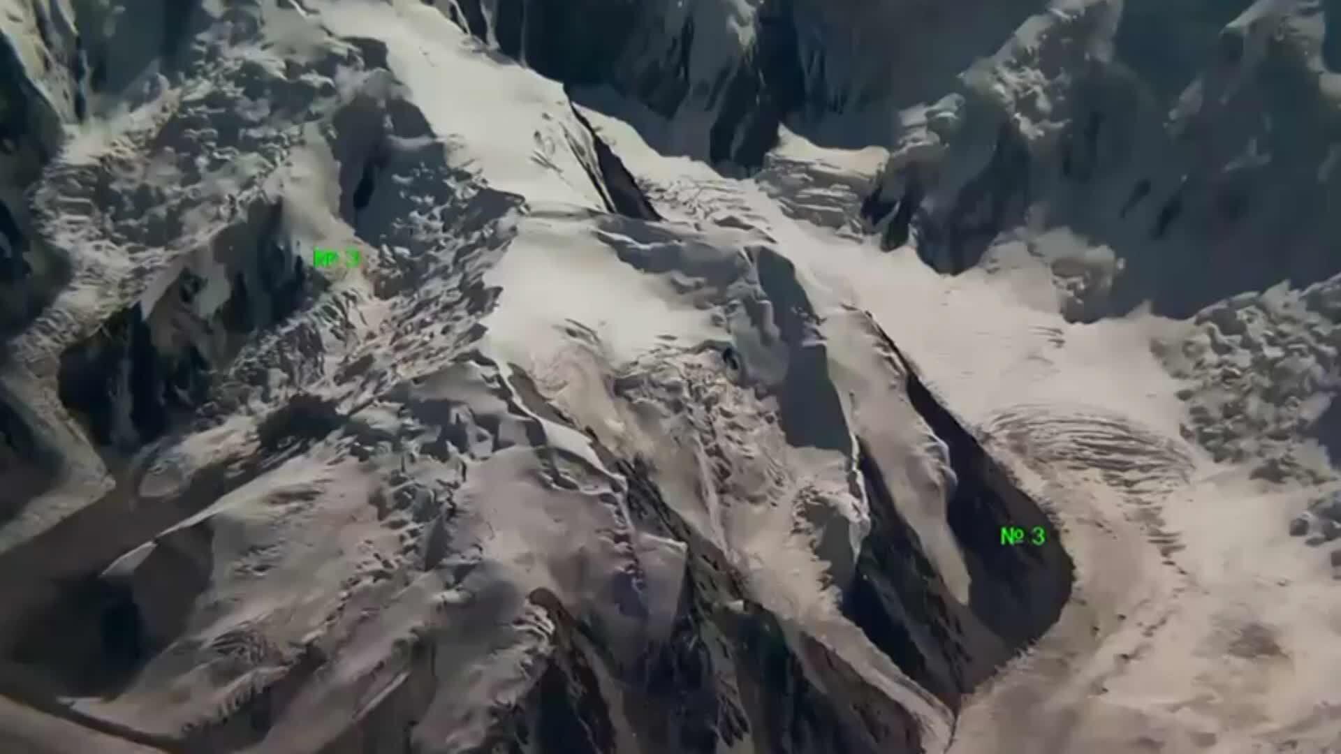 Cliffhanger - Drone footage of Kyrgyz Victory Peak as stranded Russian ...